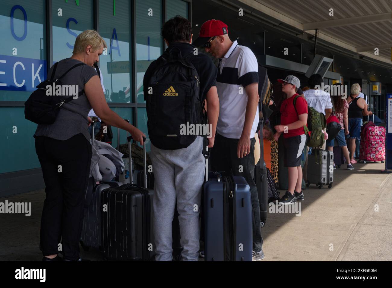 New York, New York, USA. 2nd July, 2024. Travelers wait in line for ...