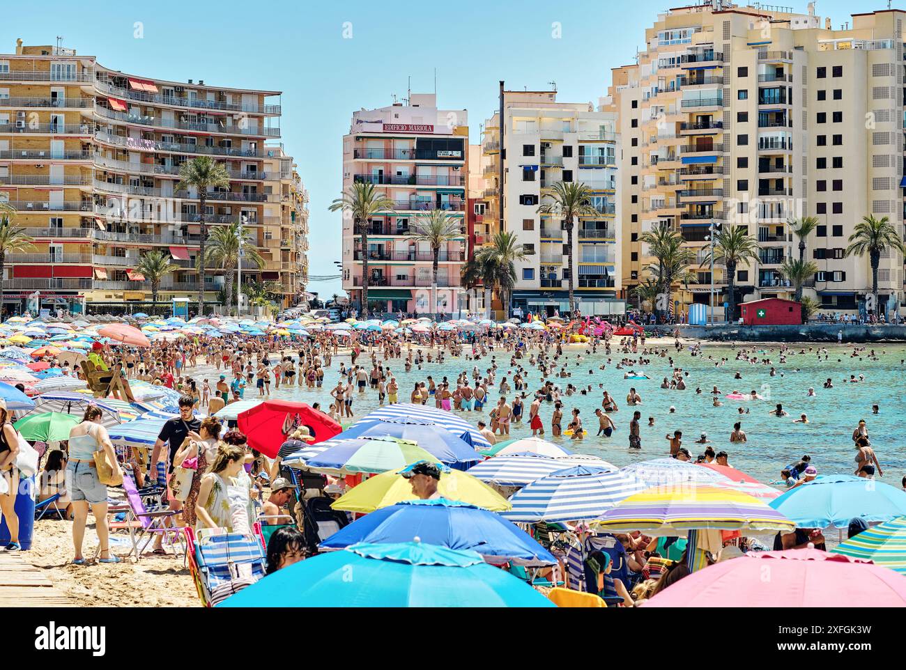 Torrevieja, Spain - June 23, 2024: Lot of people sunbathing on Playa ...