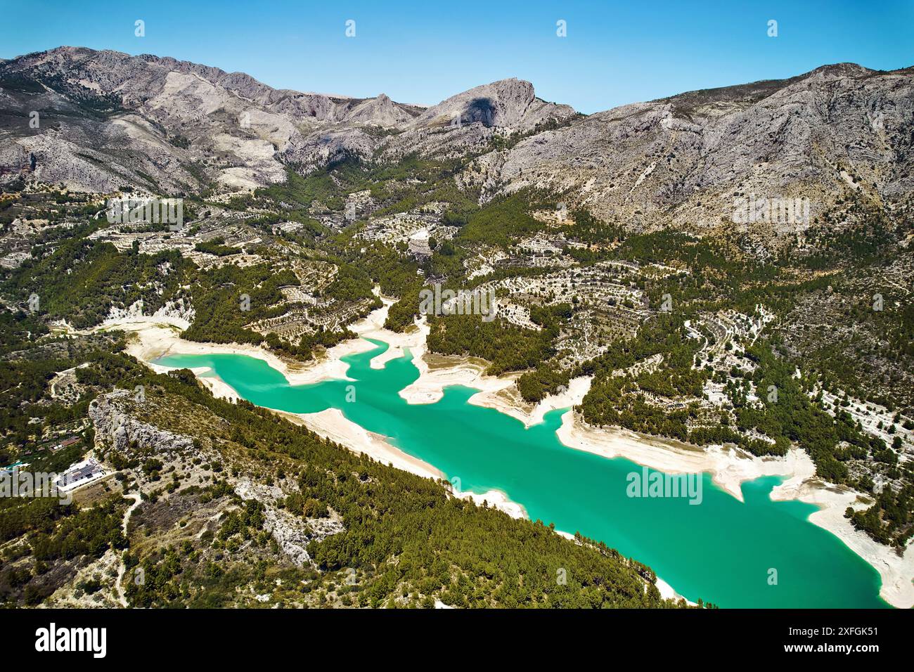 Aerial view Guadalest Reservoir (Embalse de Guadalest) turquoise water ...