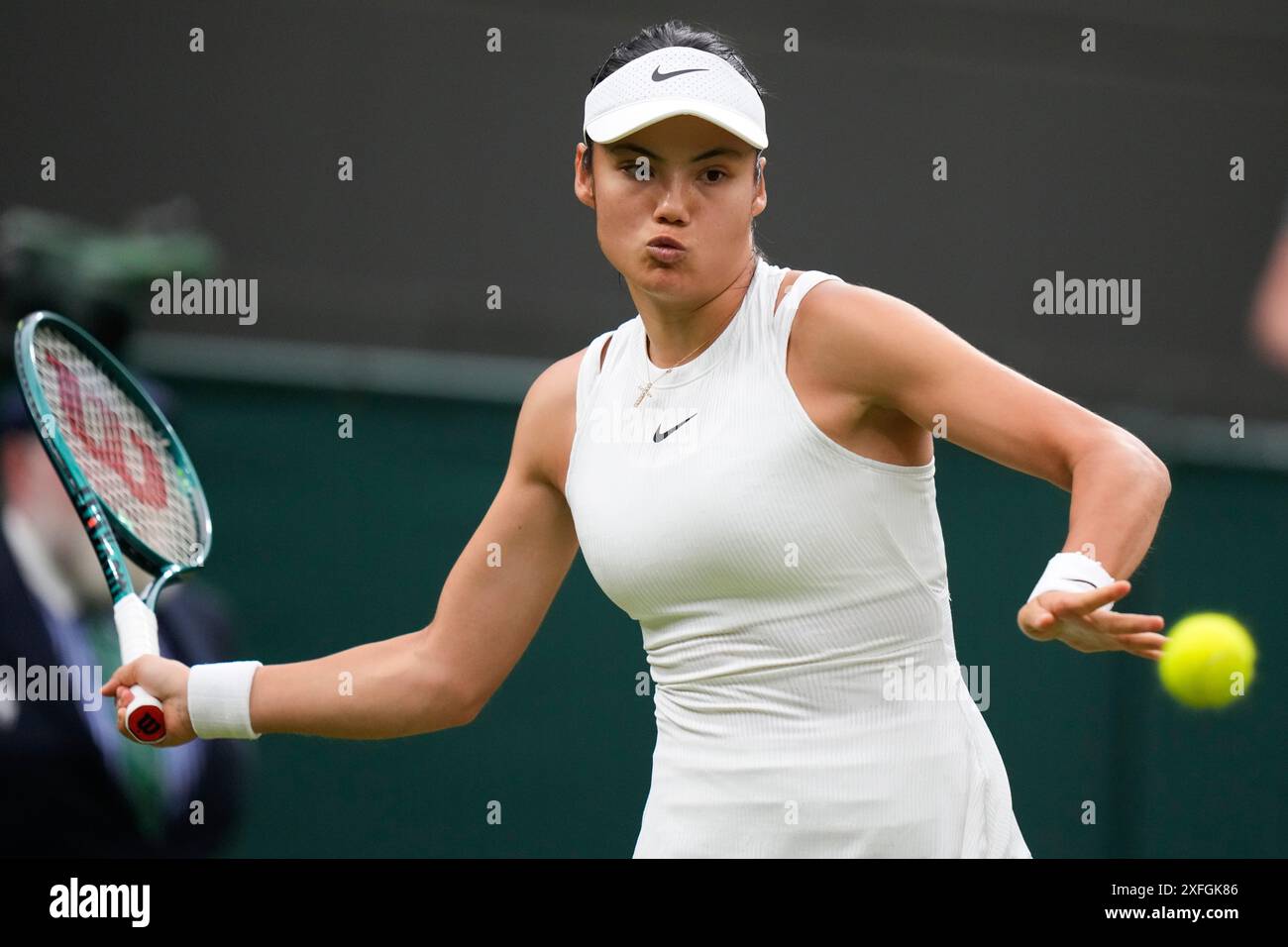 Emma Raducanu of Britain plays a forehand return to Elise Mertens of ...