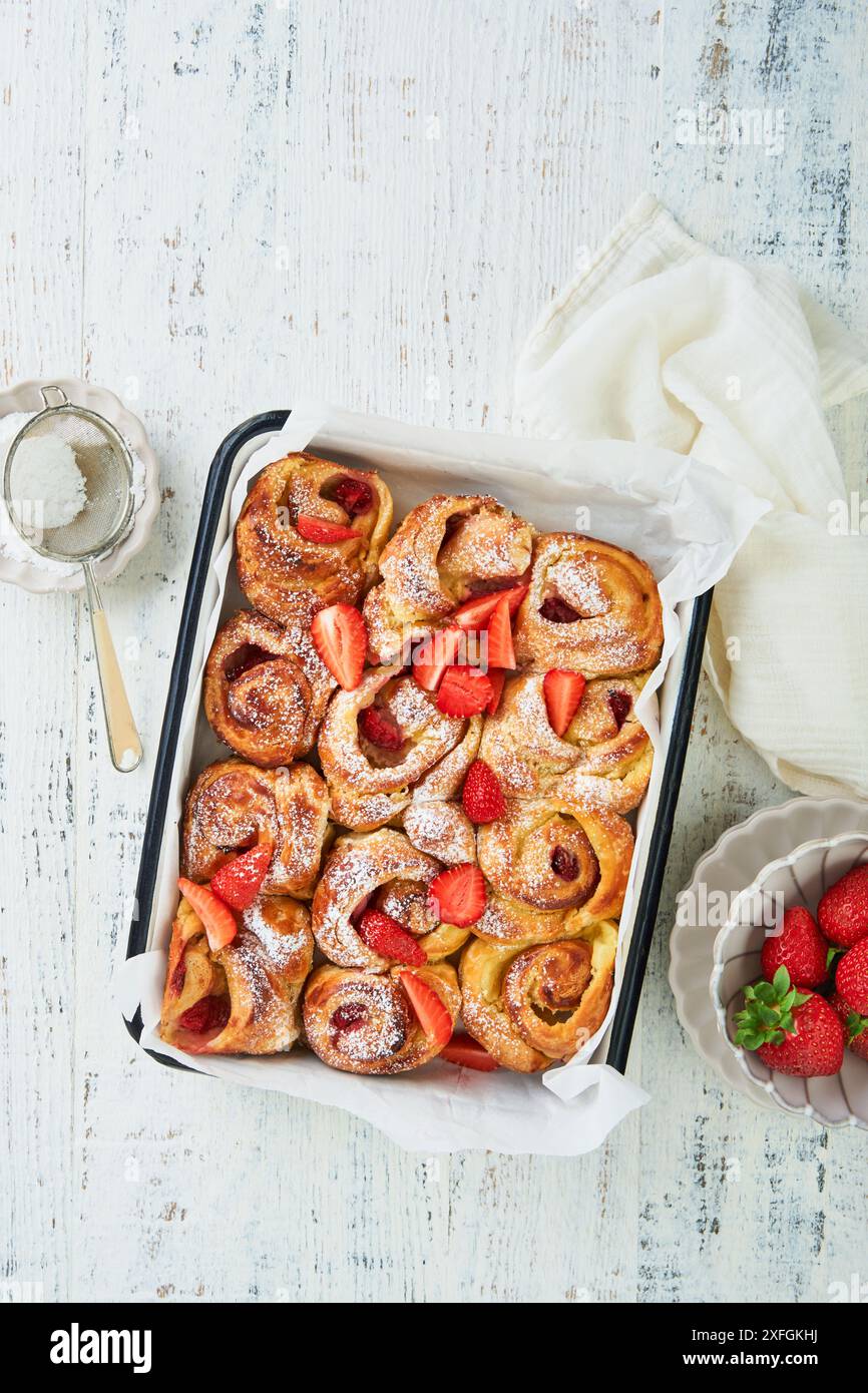 Strawberry rollies puff pastry with custard inside and sprinkled with ...