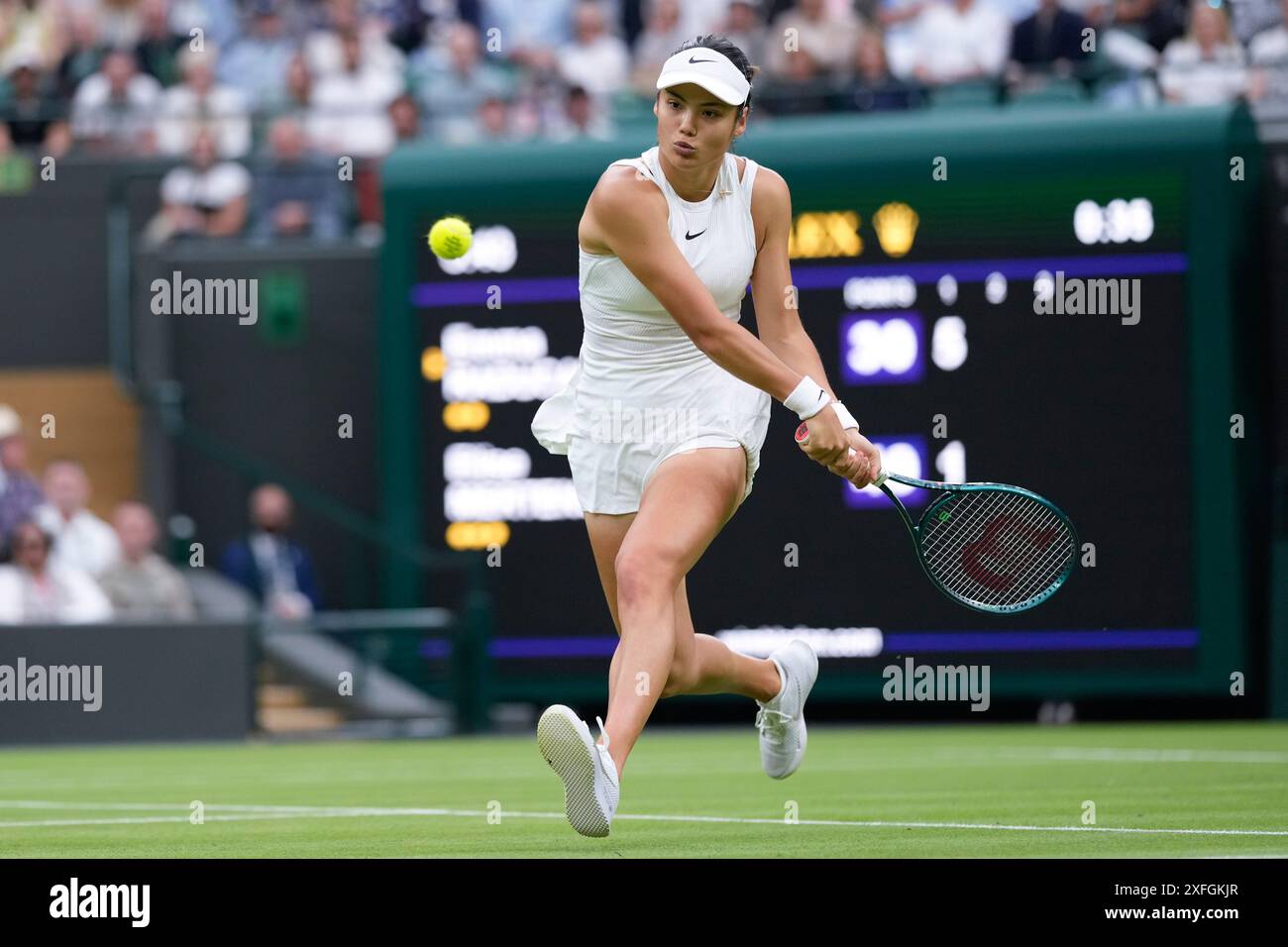 Emma Raducanu of Britain plays a backhand return to Elise Mertens of ...