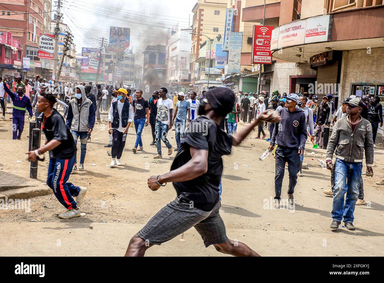 Nairobi, Kenya. 2nd July, 2024. Angry protesters throw stones at riot ...