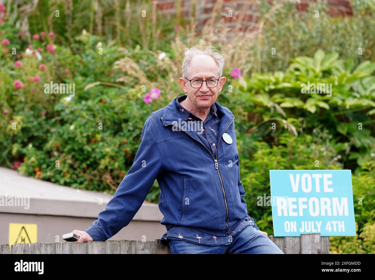 Reform UK supporter near to Clacton Pier in Essex, as they wait for ...