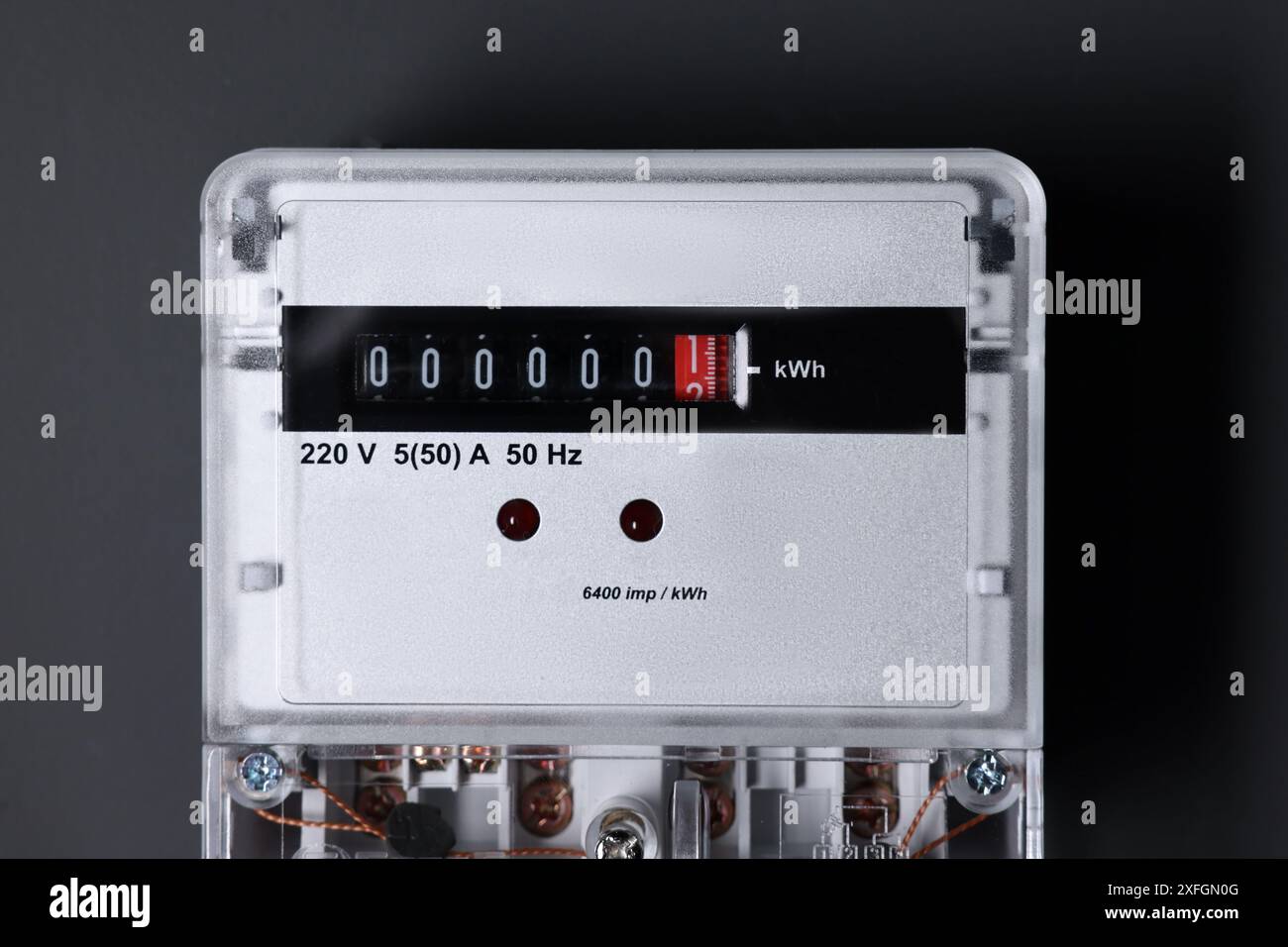 Electric meter on black background. Energy measuring device Stock Photo ...