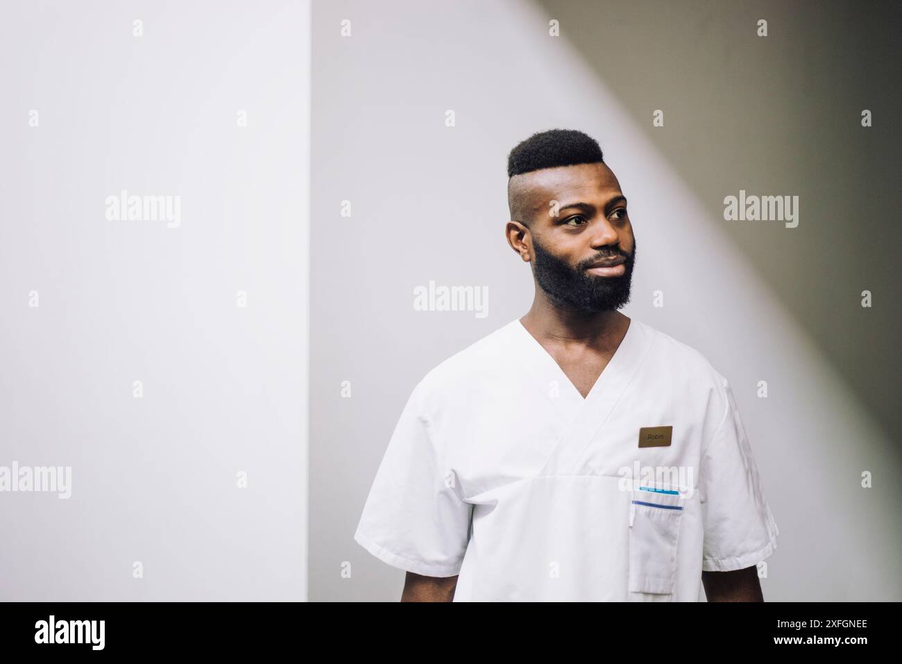 Thoughtful professional in white hi-res stock photography and images ...