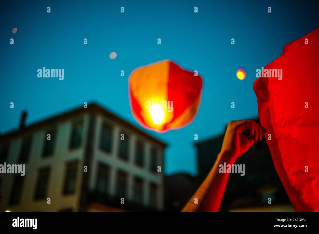 Colorful balloons fill the sky over Oporto's historic district during ...