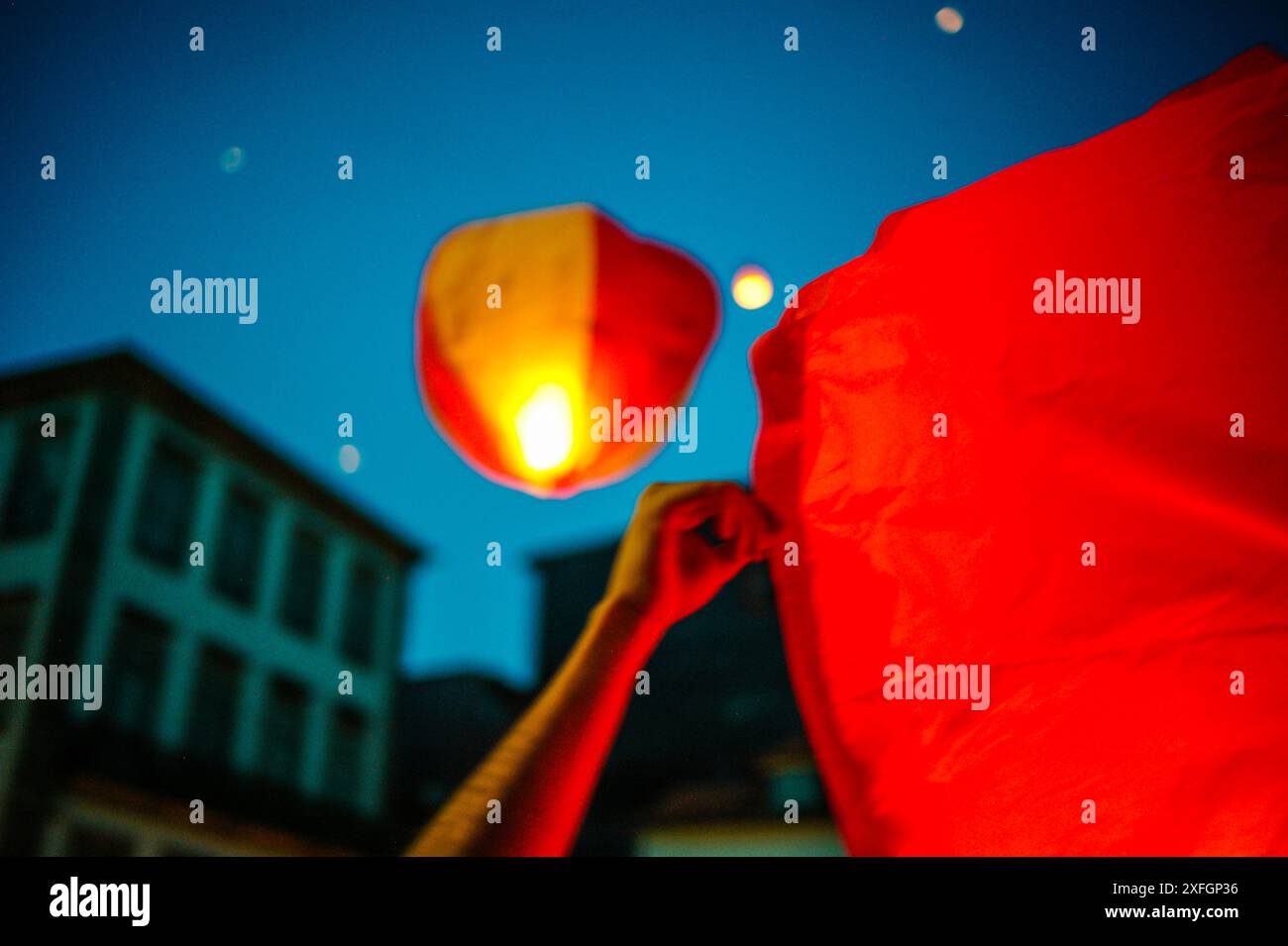Colorful balloons fill the sky over Oporto's historic district during ...