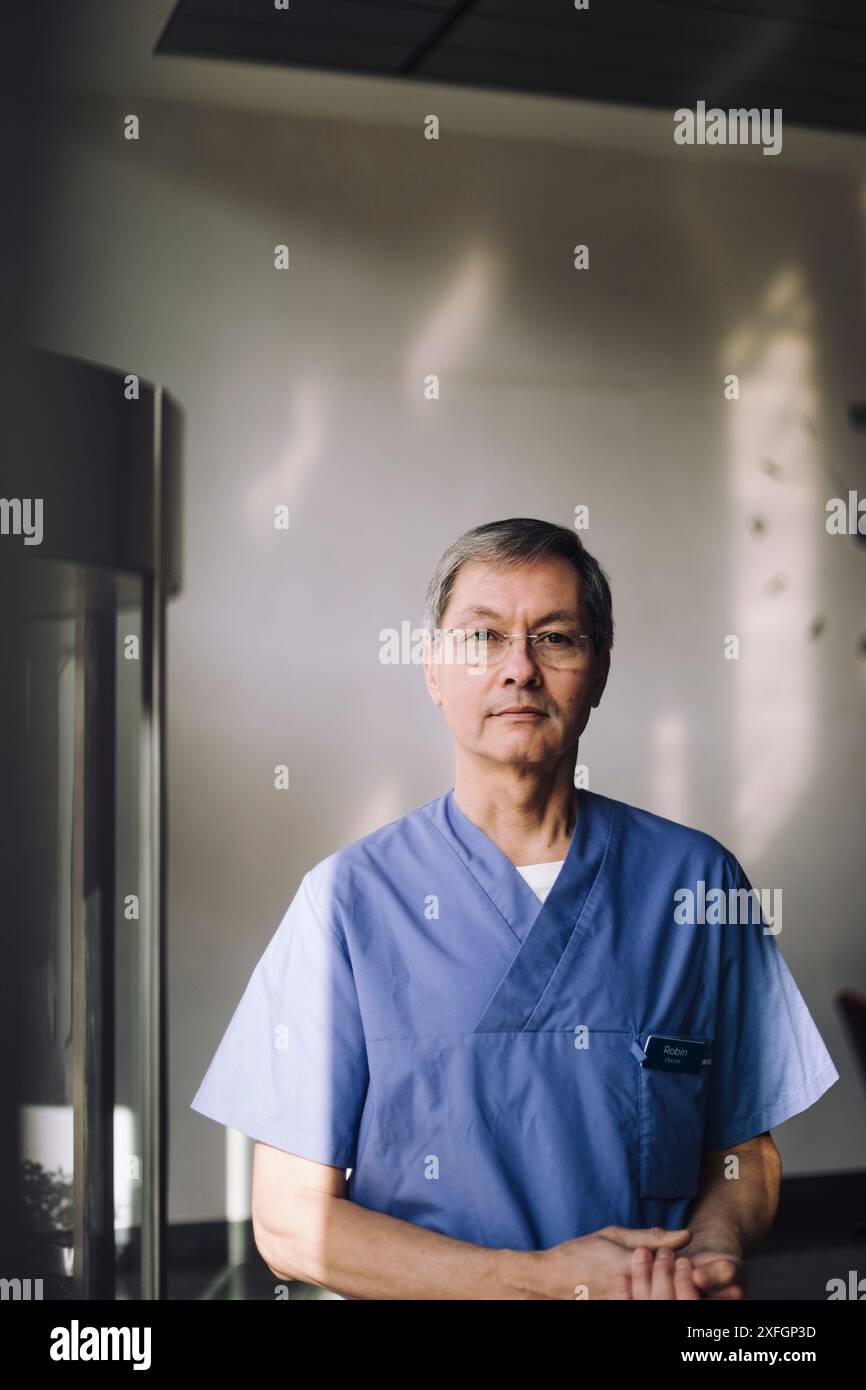 Portrait of confident senior male doctor at hospital Stock Photo - Alamy