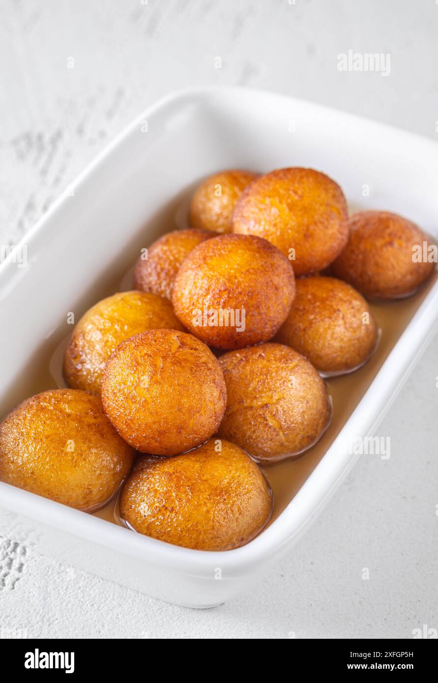 Gulab jamun indian dessert soaked in syrup Stock Photo - Alamy