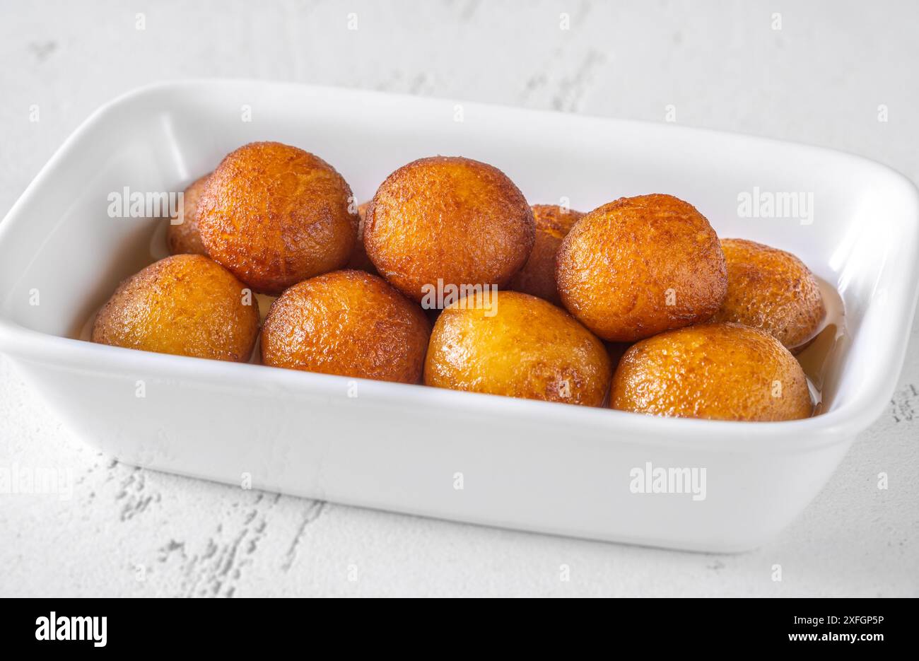 Gulab jamun indian dessert soaked in syrup Stock Photo - Alamy