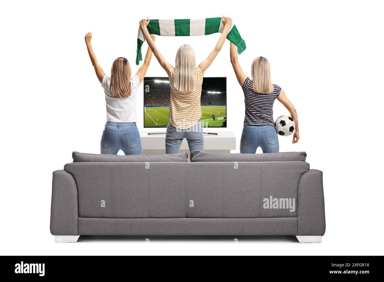 Rear view shot of young female football fans cheering and watching tv ...