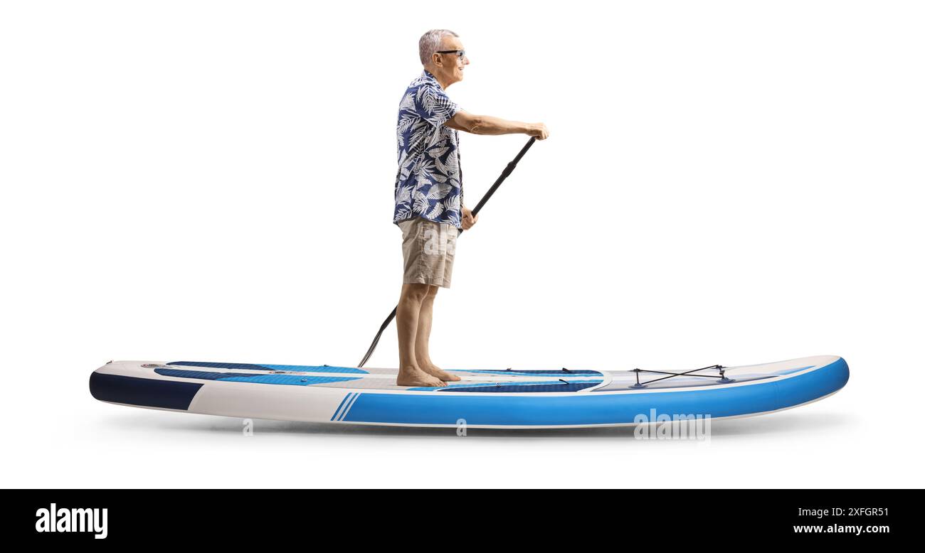 Elderly man paddling a SUP isolated on white background Stock Photo - Alamy