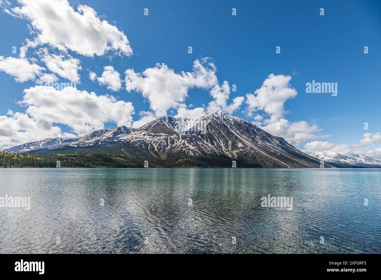 Rocky lake shore of stunning, isolated lake in northern Canada during ...