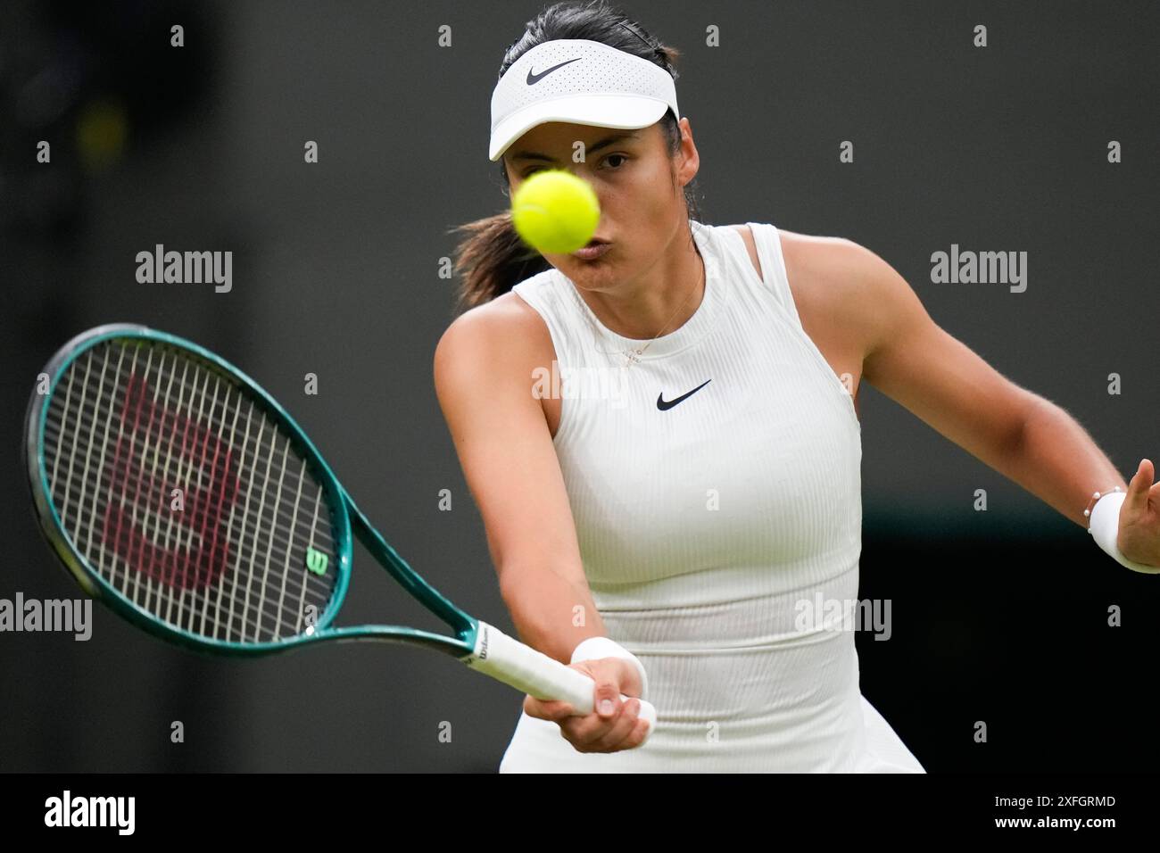 Emma Raducanu of Britain plays a forehand return to Elise Mertens of ...