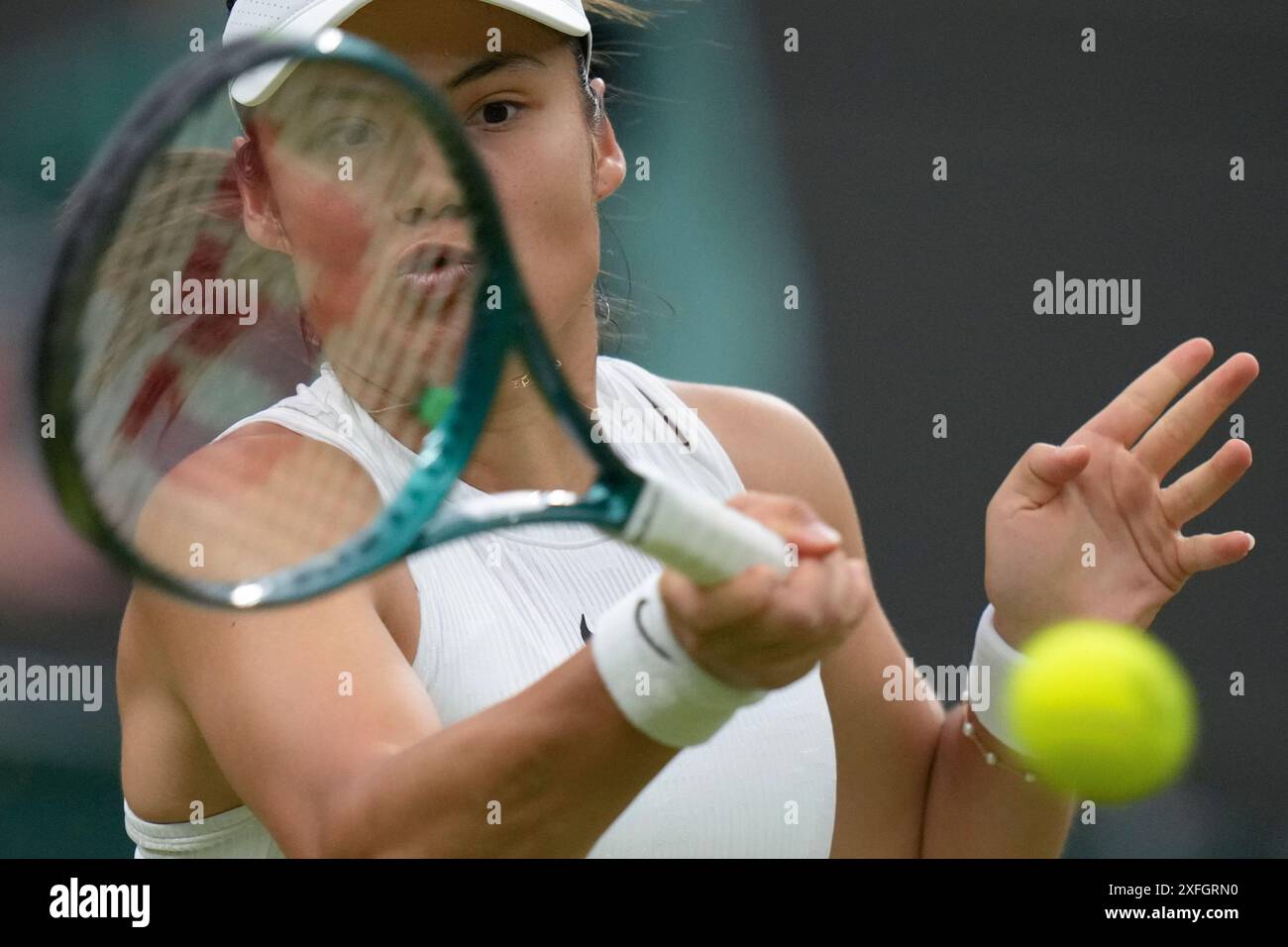 Emma Raducanu of Britain plays a forehand return to Elise Mertens of ...