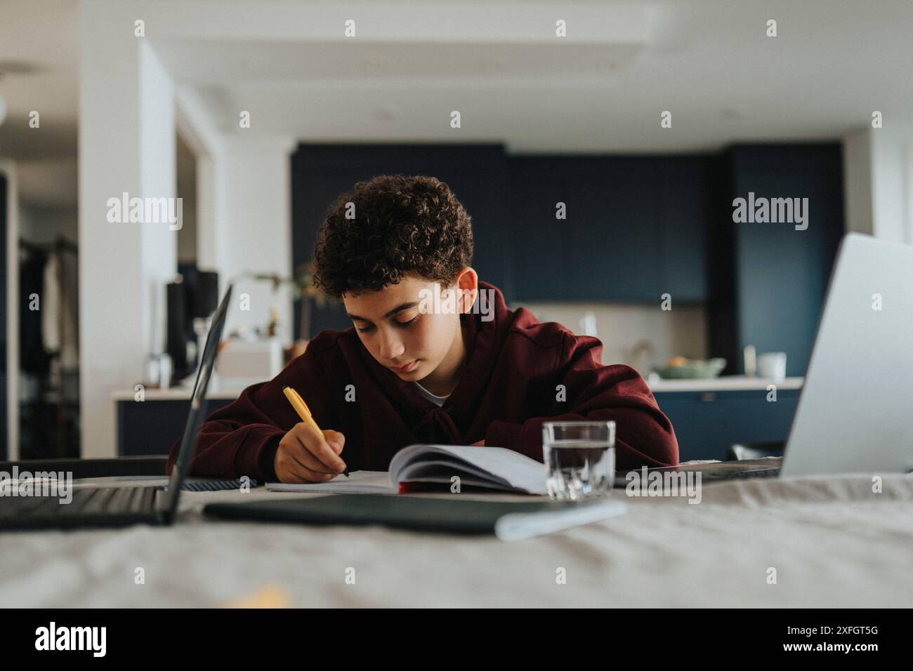 Sitting near table hi-res stock photography and images - Alamy