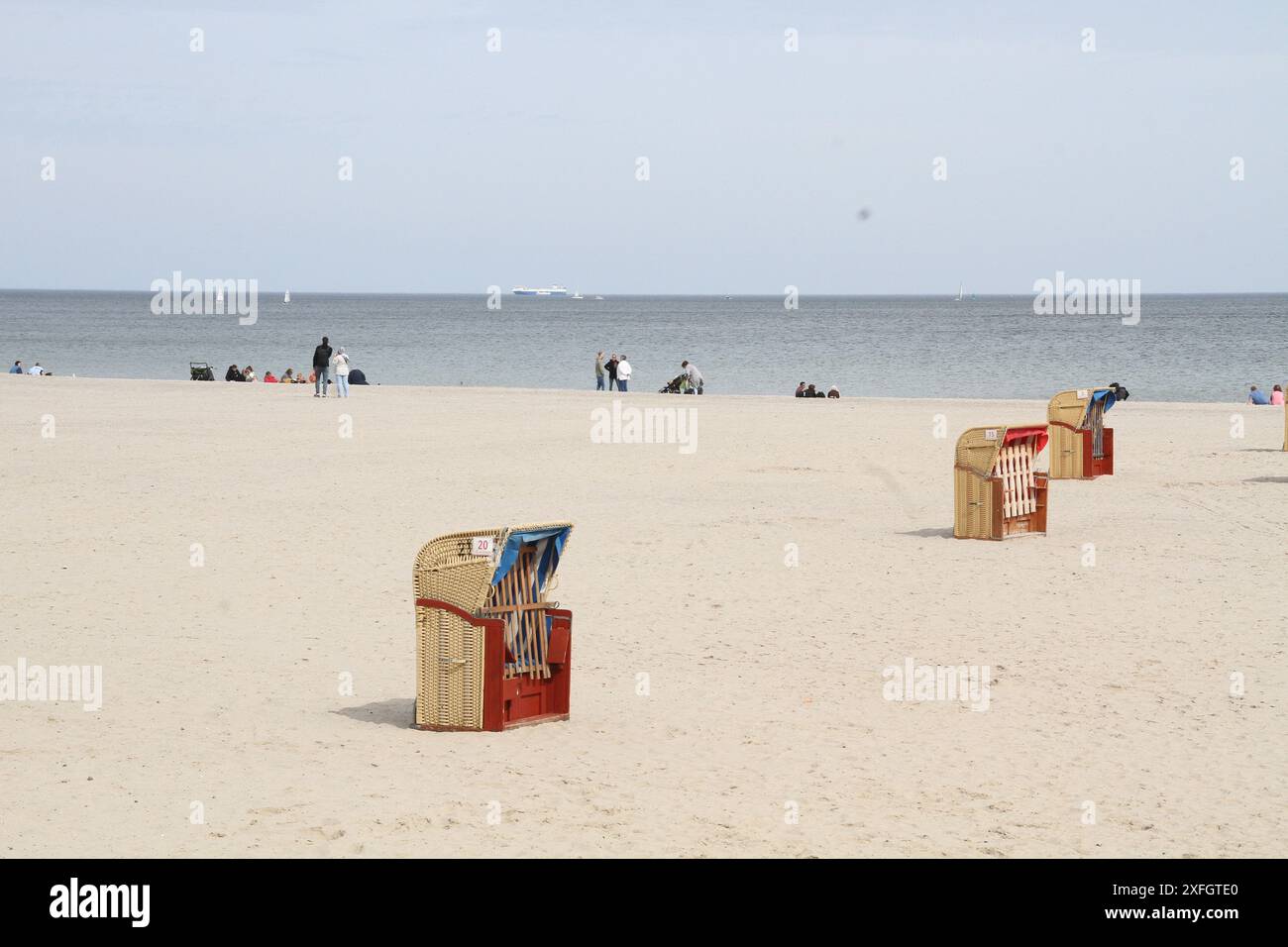 Typical north geman strandkorb beach seats on the beige seats and sea ...