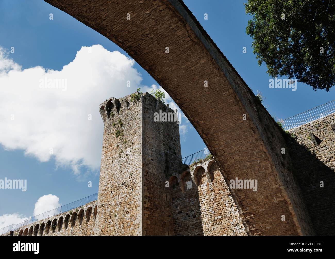 Perfectly preserved city wall with the Sienese Arch and the fortress in ...