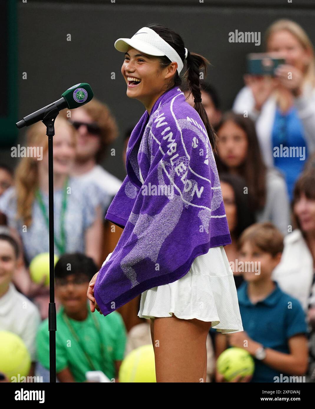 Emma Raducanu is interviewed following her match against Elise Mertens ...