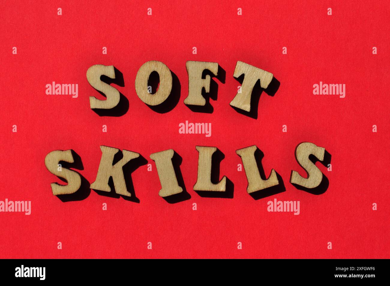Soft Skills, words in wooden alphabet letters isolated on red ...