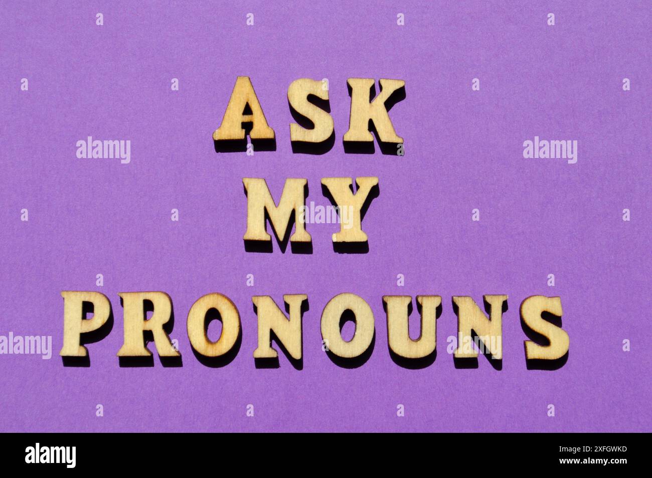 Ask My Pronouns, words in wooden alphabet letters isolated on purple ...