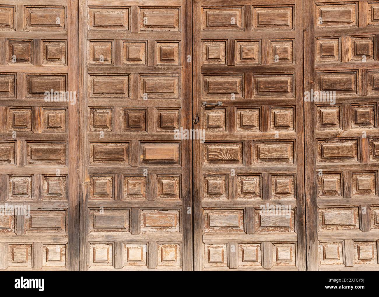Wooden old door with a small lock and an iron handle. Texture ...