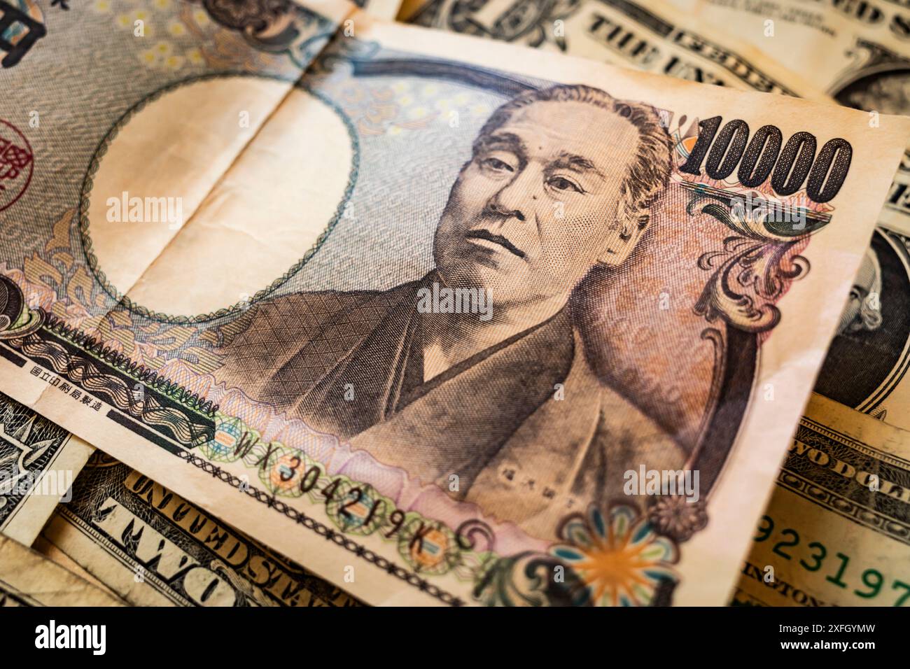 July 3, 2024, Tokyo, Japan: Stock images of a 10,000 Yen note and $1 US ...