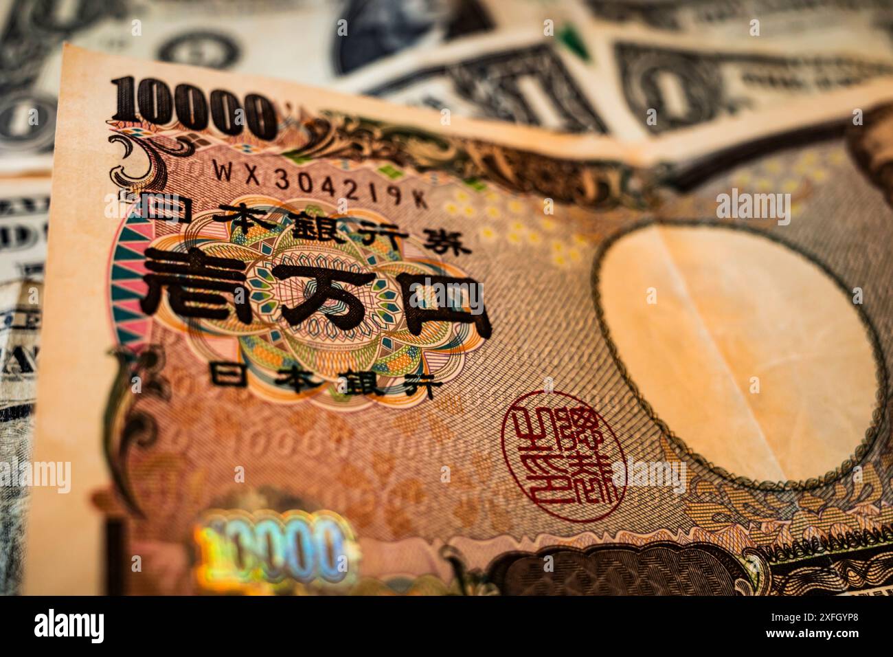 July 3, 2024, Tokyo, Japan: Stock images of a 10,000 Yen note and $1 US ...