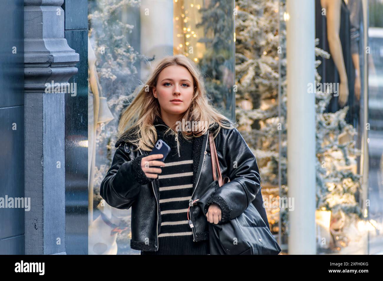 Street portrait of Dublin’s woman. A blonde young woman in a leather ...