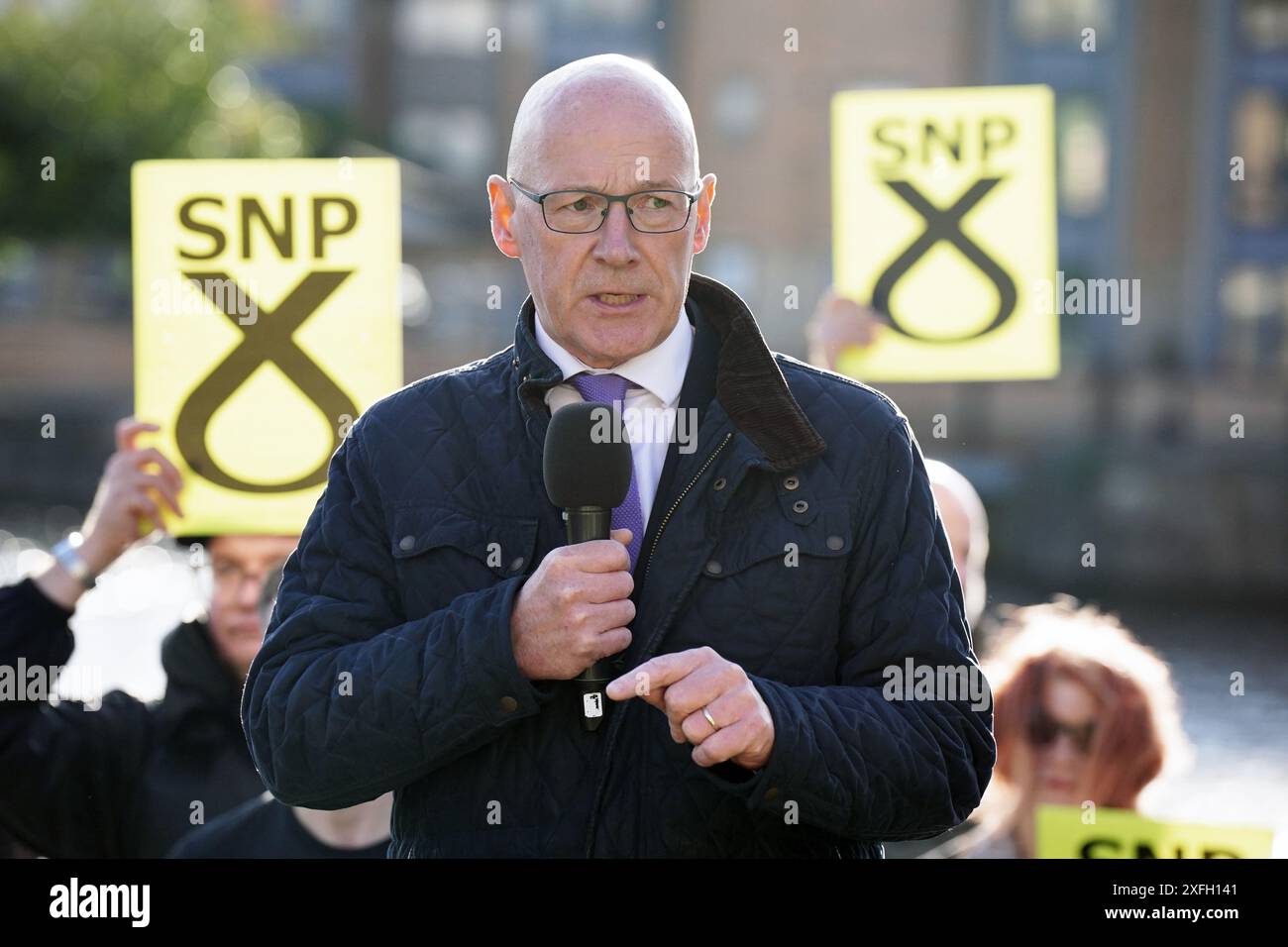 Scottish First Minister and SNP leader John Swinney giving a speech in ...