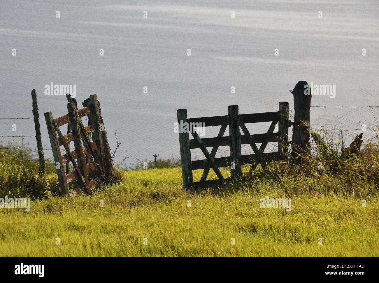 Rustic rural farm gate overlooking the lake Stock Photo - Alamy