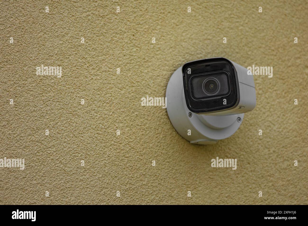 Video monitoring camera installed on the building's facade, protecting ...