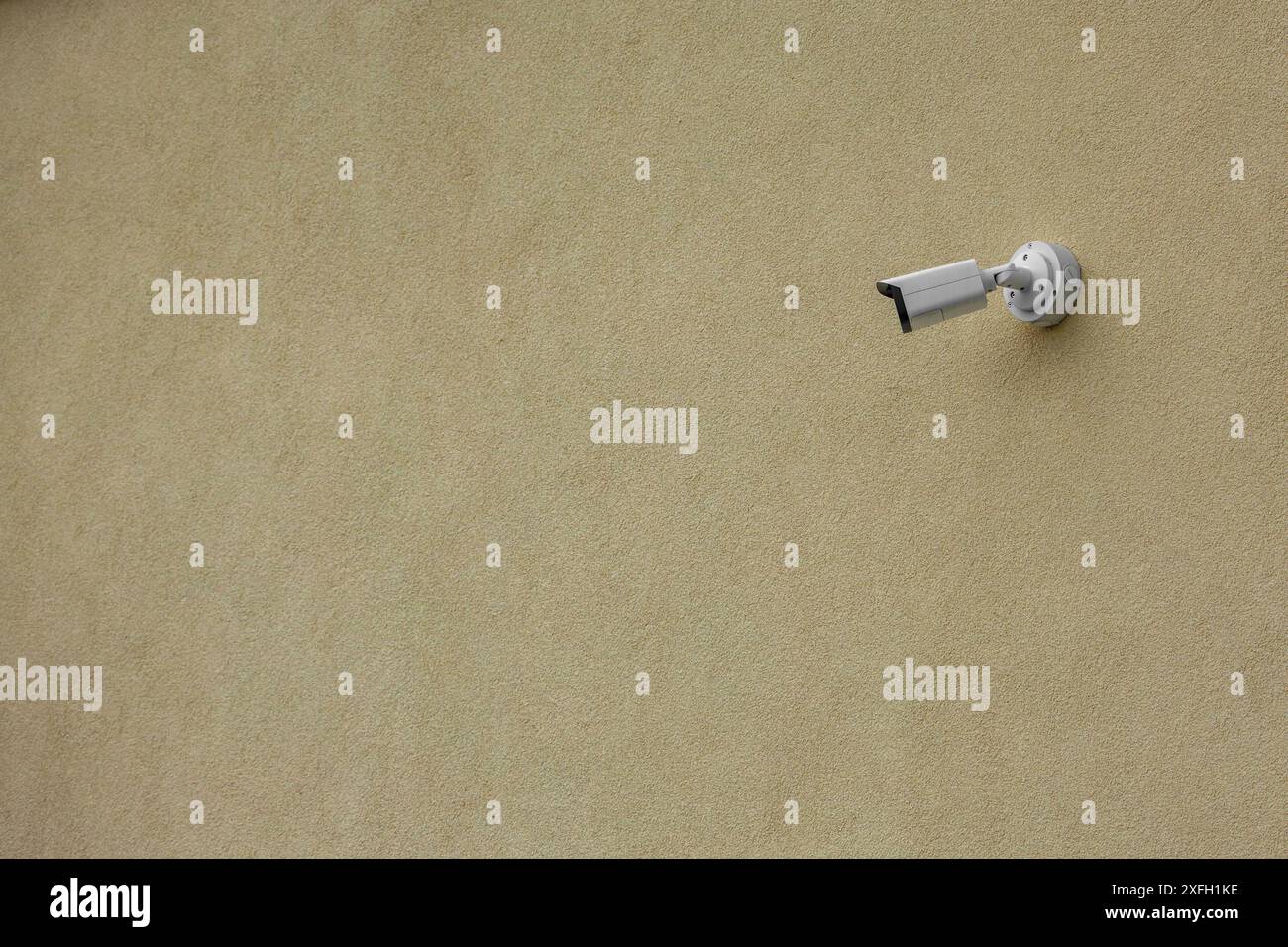 Video monitoring camera installed on the building's facade, protecting ...