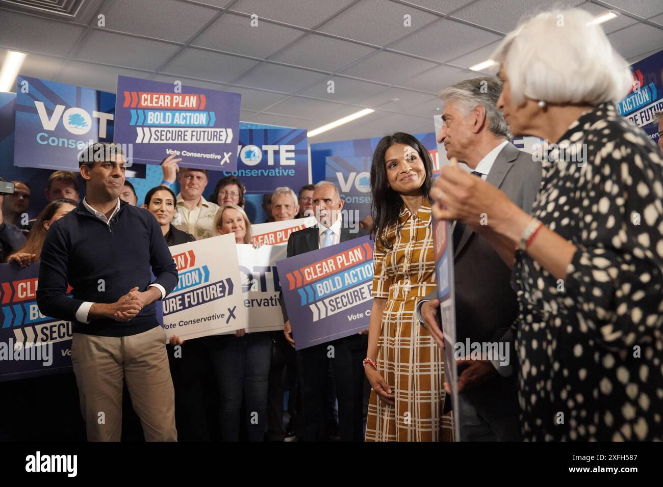 (front left-right) Prime Minister Rishi Sunak giving a speech, watched ...