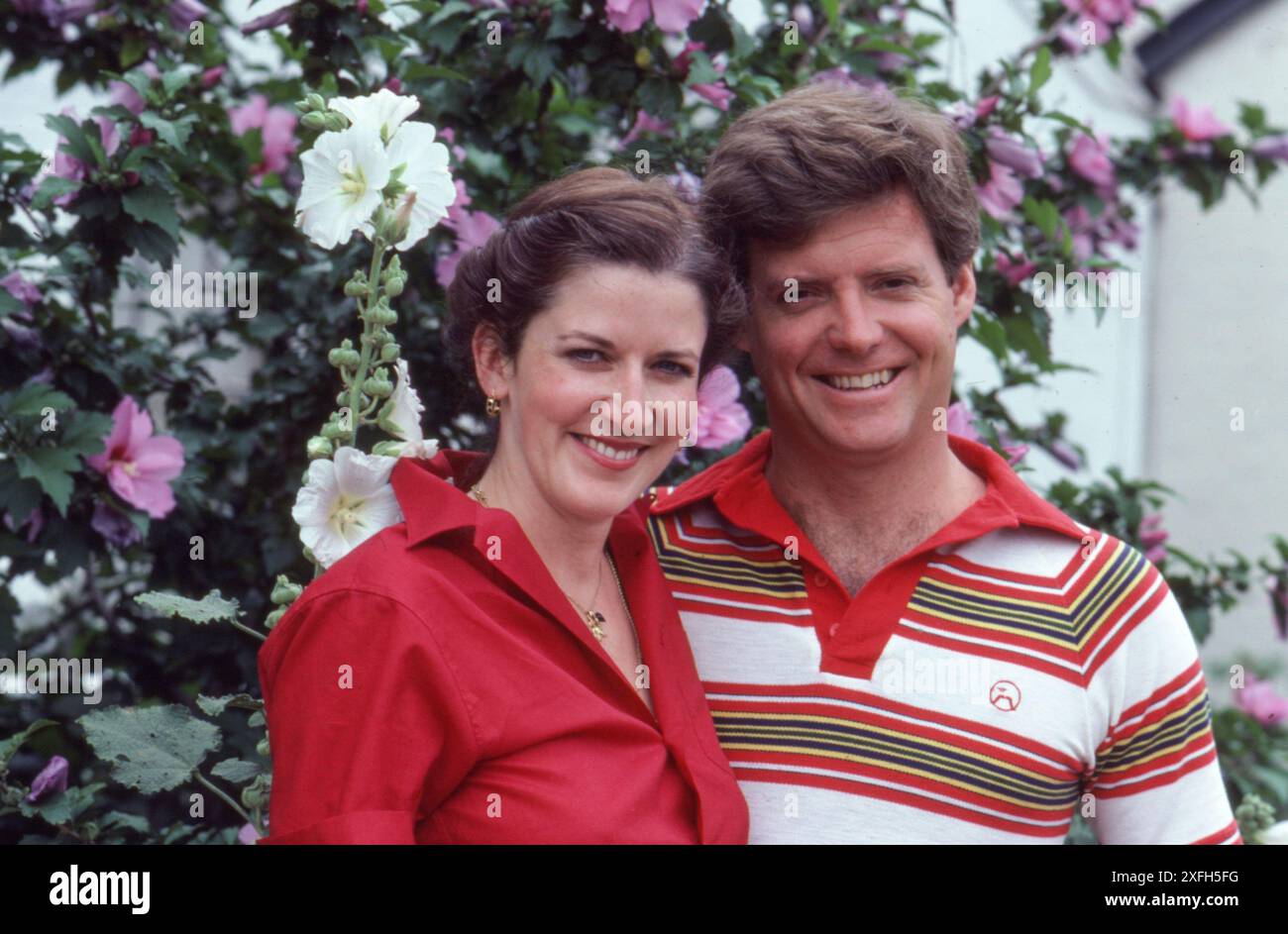 Young Married Couple Pose for A photon a flower garden, 1980s, USA ...