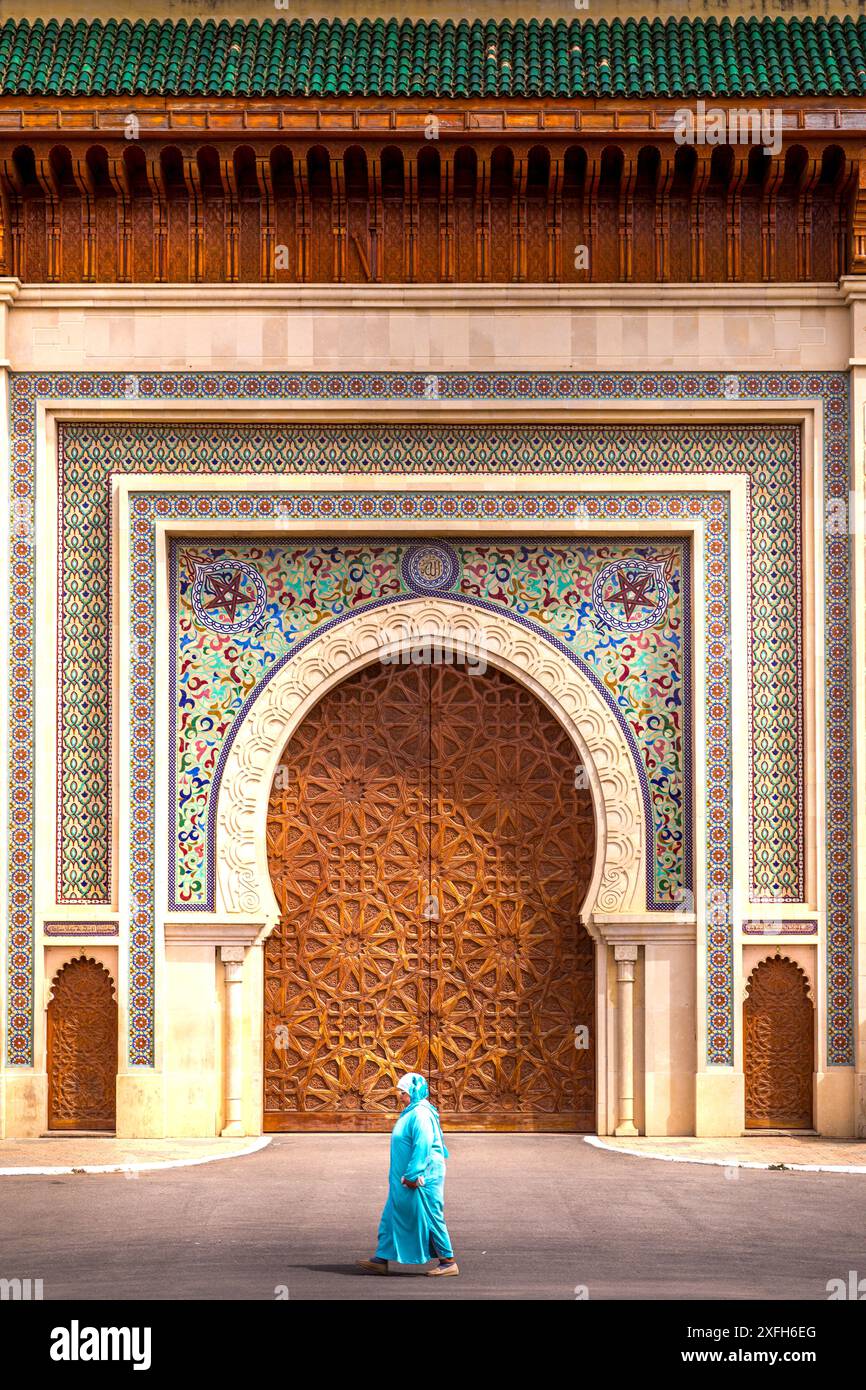 Fez, Morocco - March 23, 2024: Brass gate and zellige mosaic tilework ...