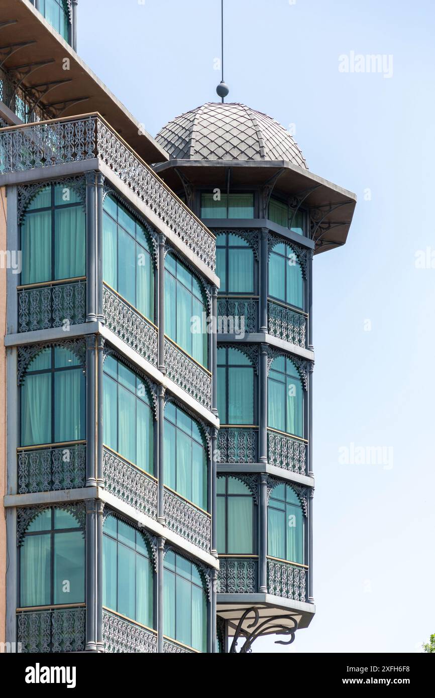 Traditional ornamental oriel windows, balconies in the streets of ...
