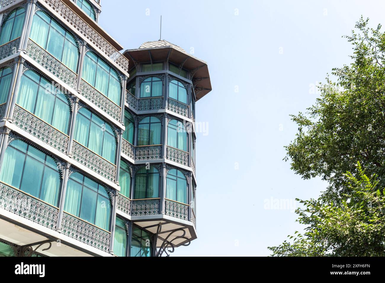 Traditional ornamental oriel windows, balconies in the streets of ...