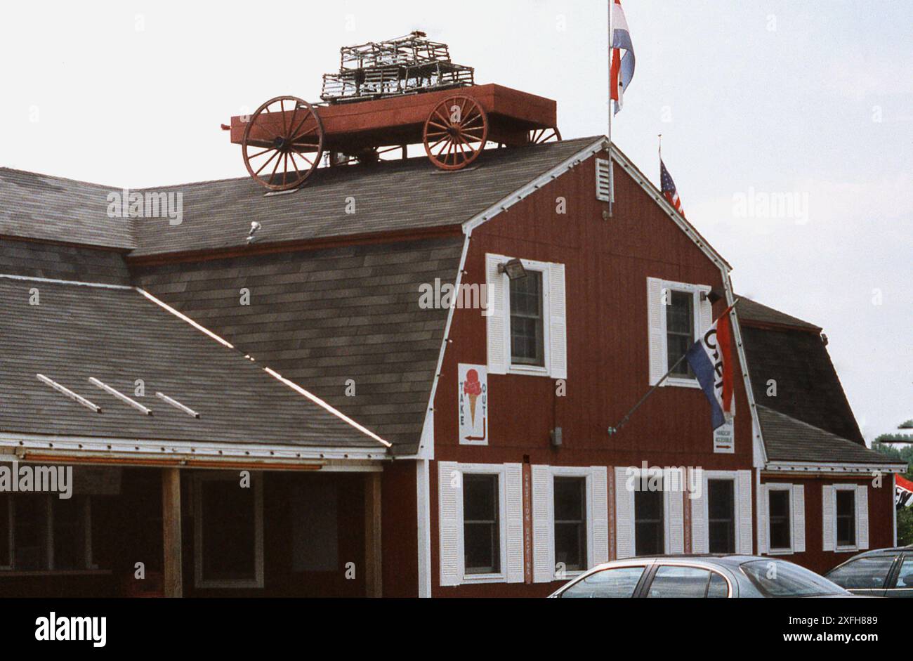 Old wagon loaded with fishing traps used as decor on top of a ...