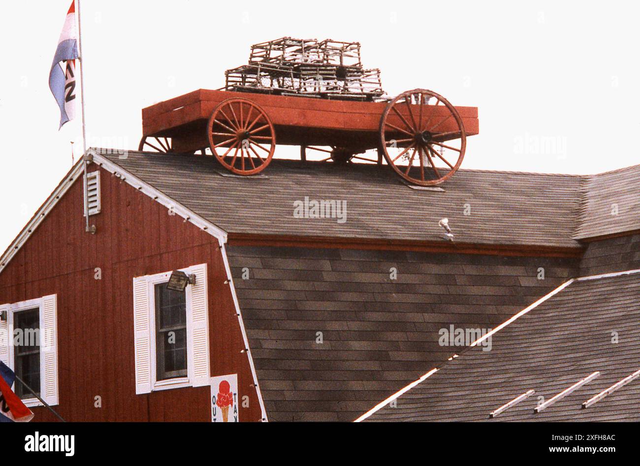 Old wagon loaded with fishing traps used as decor on top of a ...
