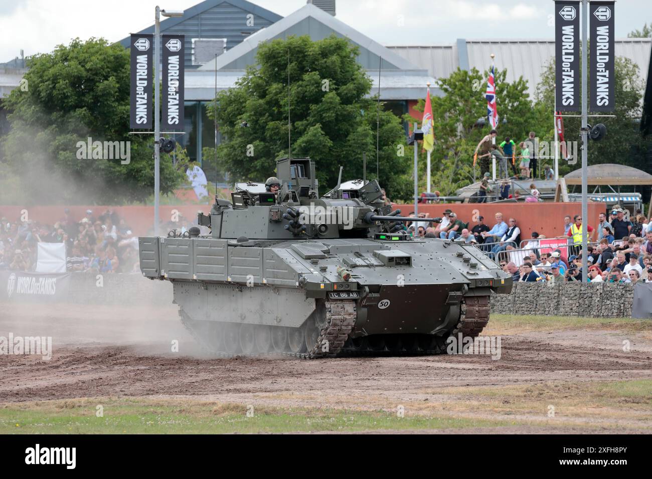 A British Army Ajax armoured reconnaissance vehicle driving around the ...