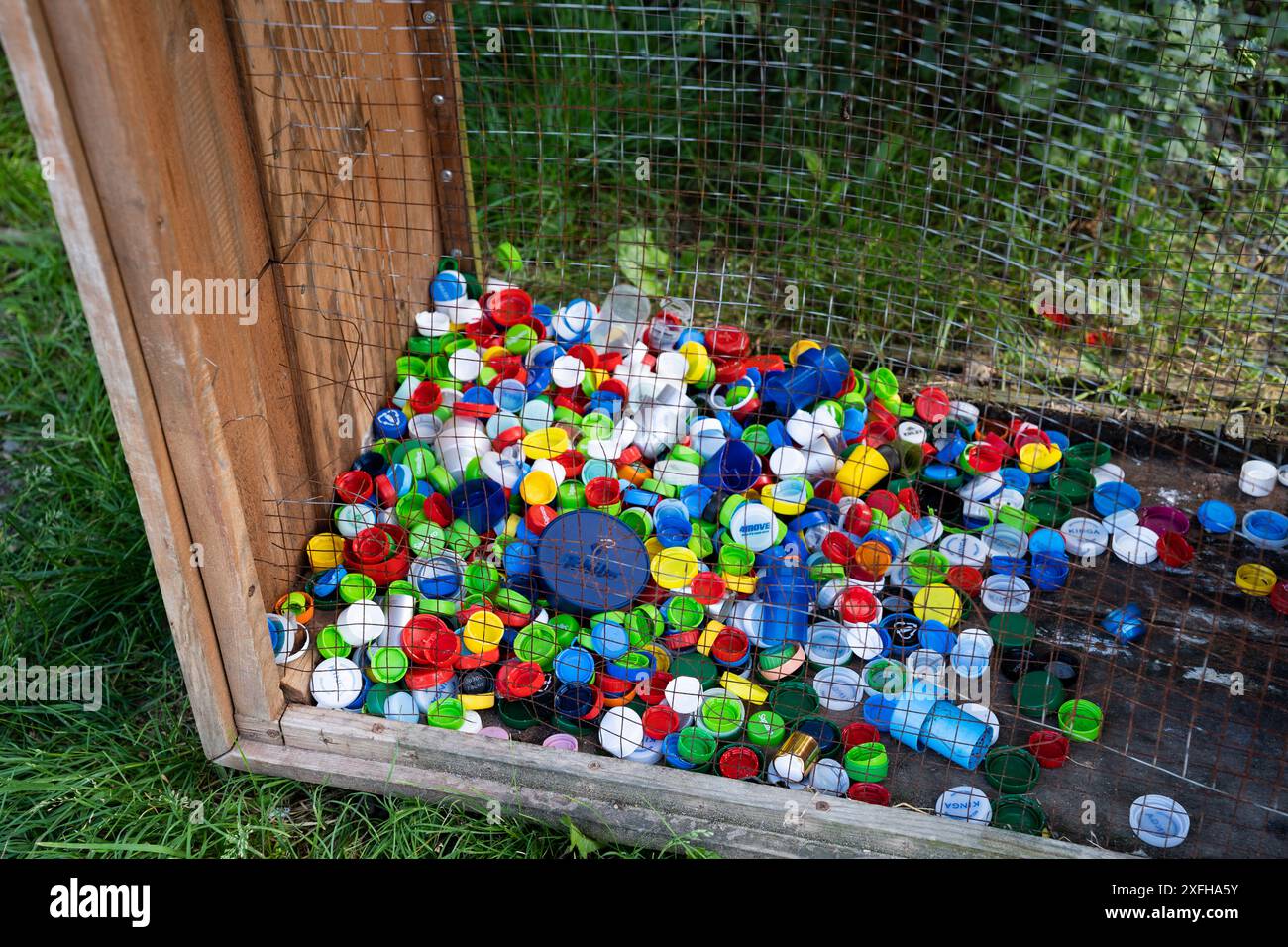 Container for collecting plastic bottle caps Stock Photo - Alamy
