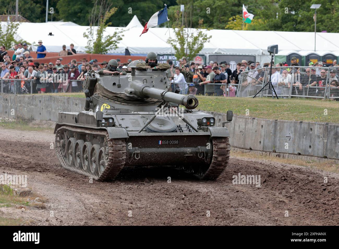 A French AMX-13 light tank driving around the arena at Bovington Tank ...