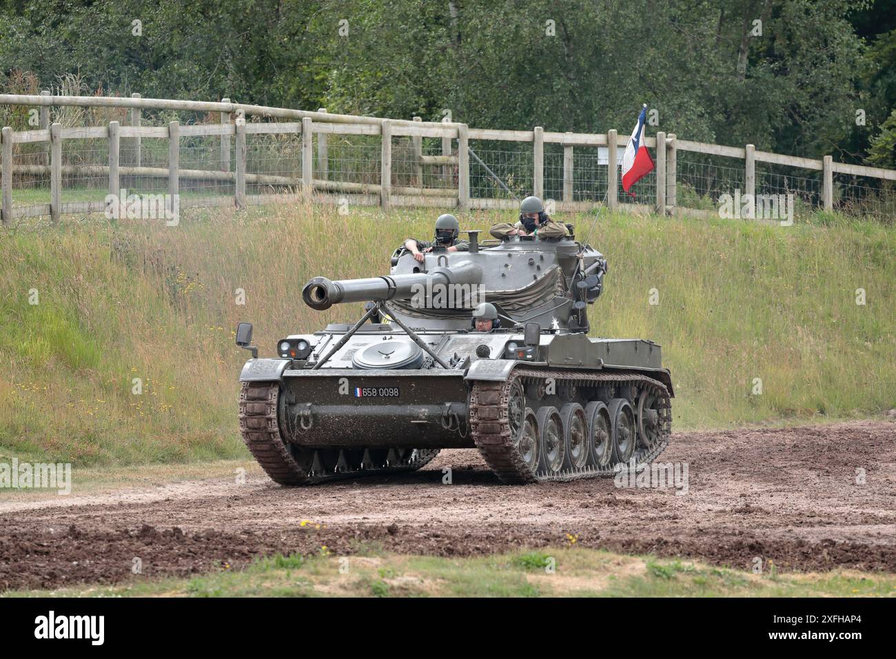 A French AMX-13 light tank driving around the arena at Bovington Tank ...