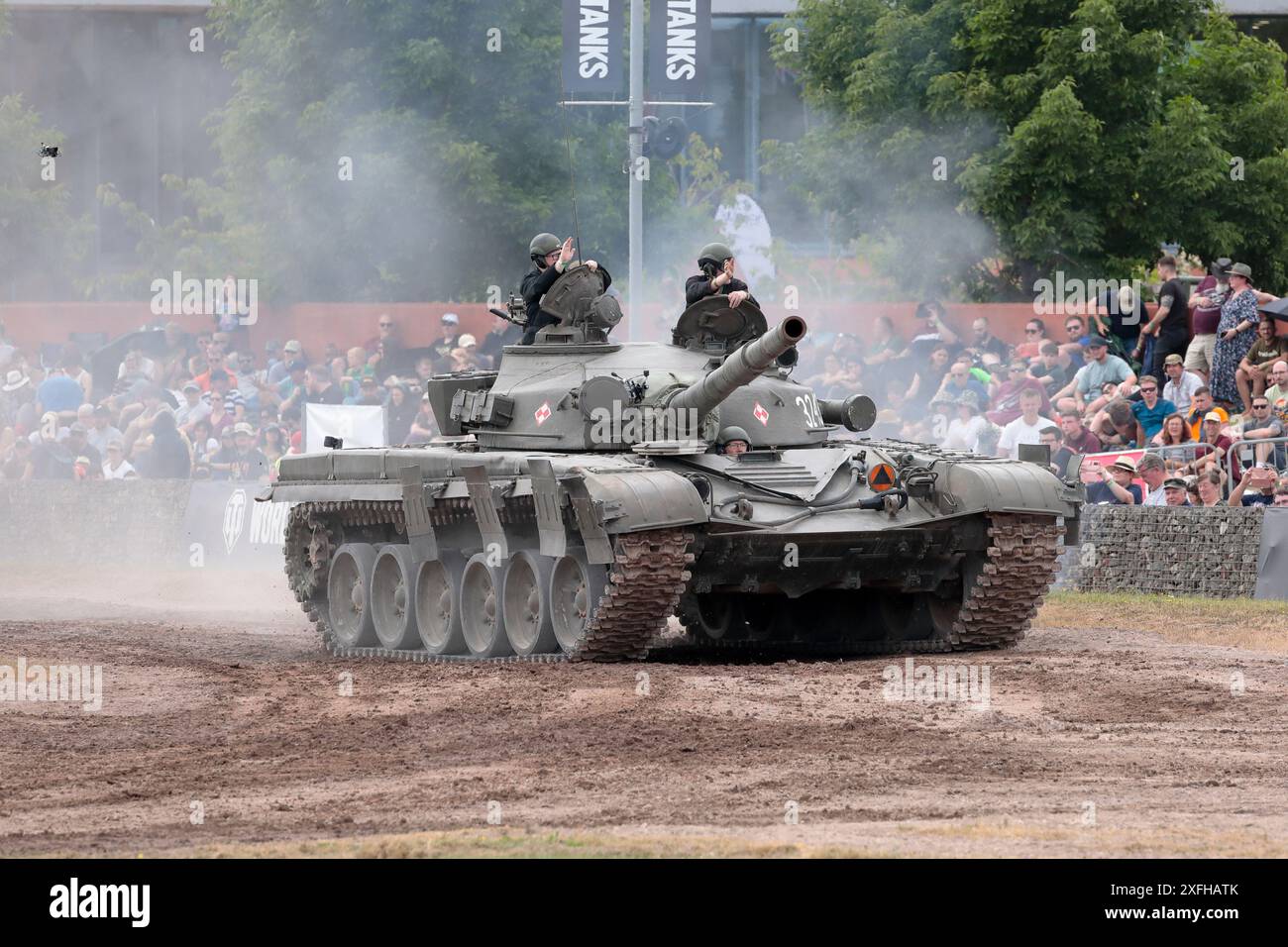 A Soviet T-72 main battle tank driving around the arena at Bovington ...