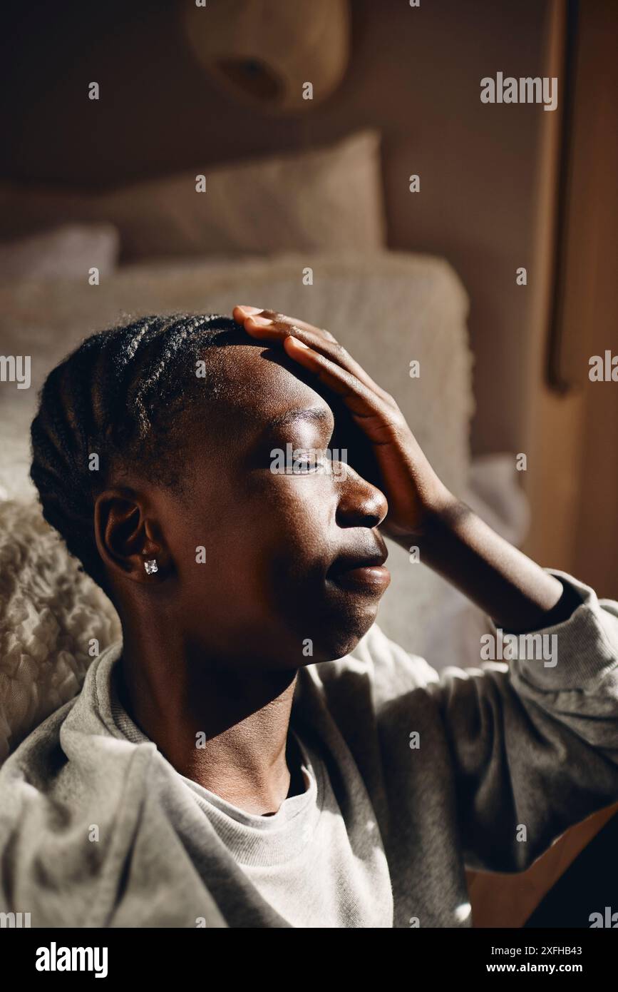 Depressed teenage boy sitting in bedroom at home Stock Photo - Alamy