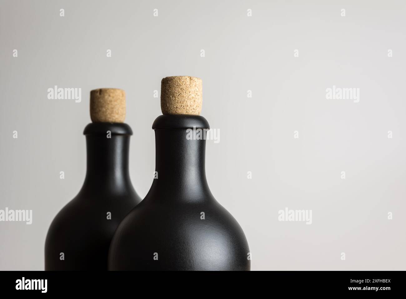 Pair of Bottles on plain background Stock Photo - Alamy