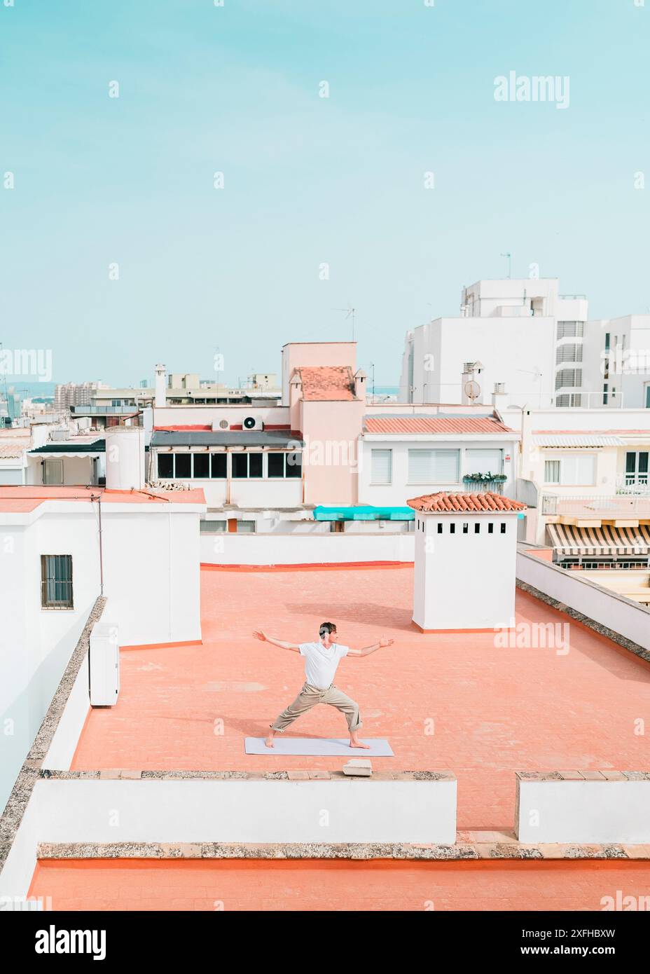 Man practicing warrior pose hi-res stock photography and images - Alamy