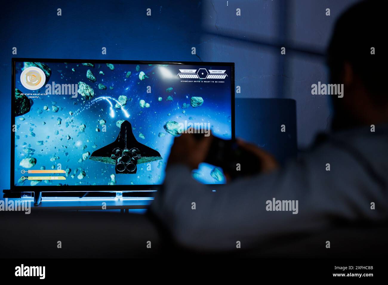 At night, dedicated person participates in online battle with long ...